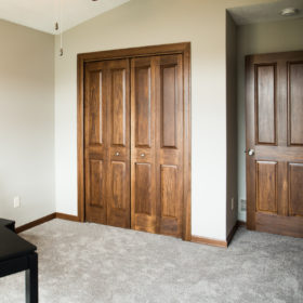 Knotty Alder Dark Wood Baseboard Trim - Iowa Remodels